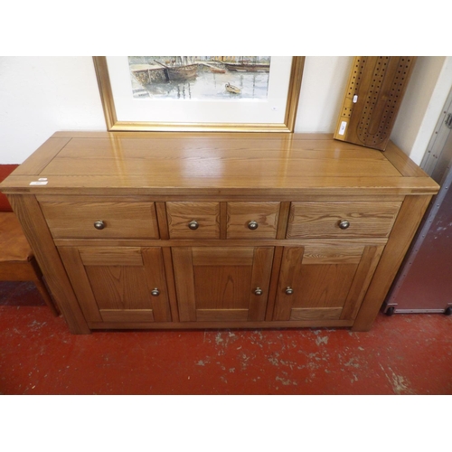 A contemporary oak sideboard