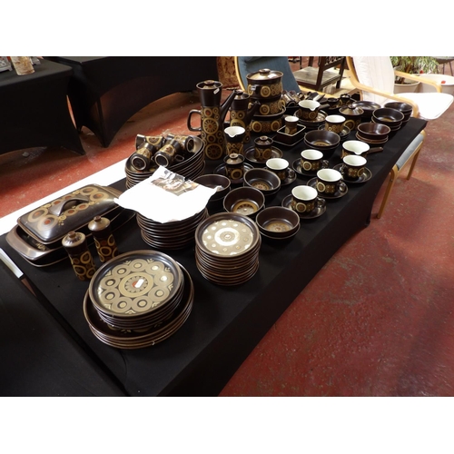 A large assortment of mid century Denby Arabesque pottery