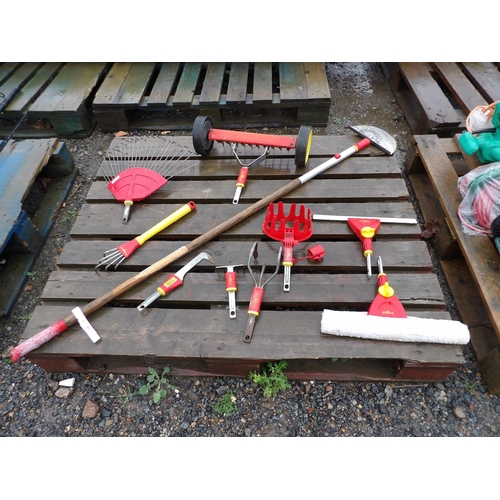 A range of Wolf interchangeable garden tools together with a handle