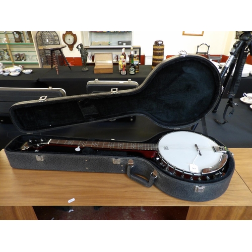 A Samick SB55 five string banjo in fitted armoured case