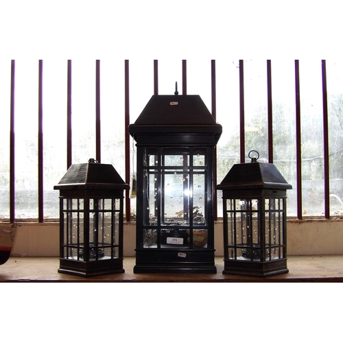 Three plastic candle lanterns