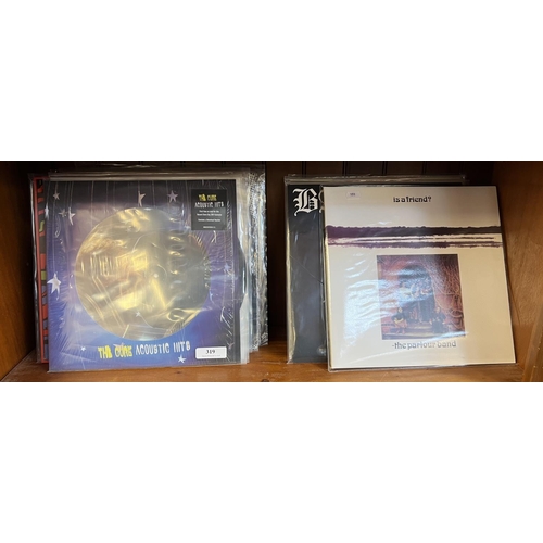 A collection of long playing records to include The Cure Acoustic Hits ...