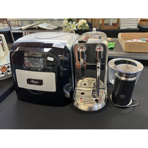 A Nespresso coffee machine together with a hostess table top ice maker ...