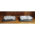 Two crystal models of motor cars on wooden plinths