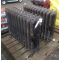A pair of French cast iron floor standing radiators with ornate designs