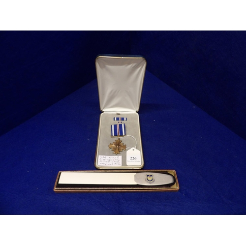A World War II USA Distinguished Flying Cross medal together with a US ...