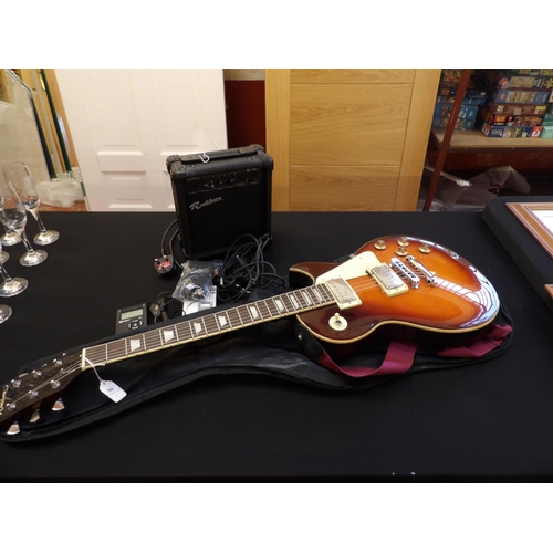 A Rockburn electric guitar, amplifier and accessories