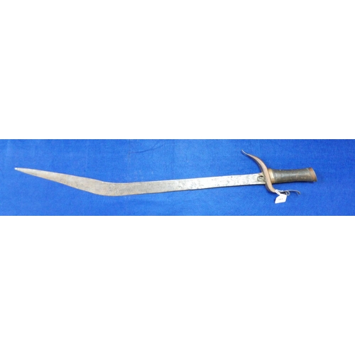 A vintage oriental sabre the blade decorated with naive designs