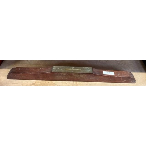 A vintage mahogany carpentry spirit level monogrammed PGV