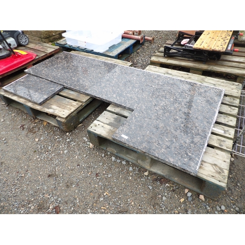A piece of stone worktop together with one other offcut