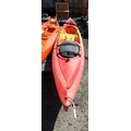 An Ocean Kayak Scupper Pro kayak and paddle