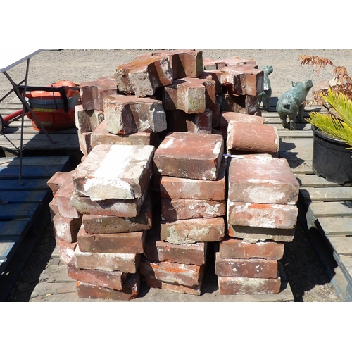An assortment of vintage Jersey red bricks by C. Copp together with ...