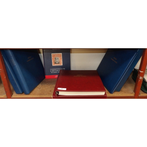 Two first day cover storage binders, a similar stamp binder and a ...