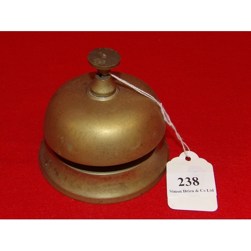 A vintage brass counter service bell