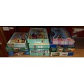 Eleven 1000 piece jigsaw puzzles