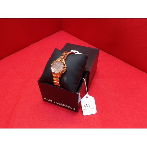 A gold tone bracelet wrist watch by Karl Lagerfeld