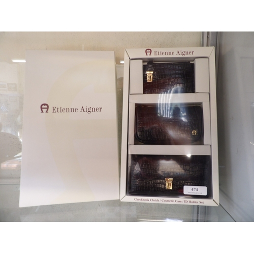 An Etienne Aigner luggage set in original box