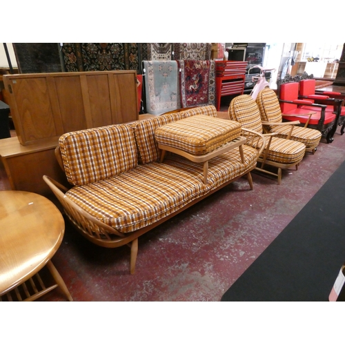 A mid century Ercol four piece lounge suite consisting of a pair of ...