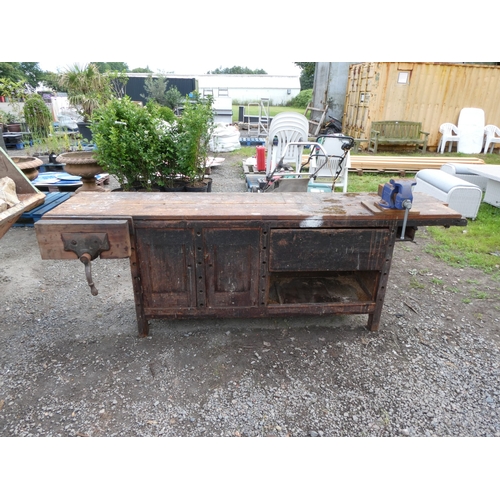 A substantial wooden workbench fitted a Sealey 125 engineering vice and ...