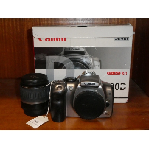 A Canon EOS 300D digital camera and accessories