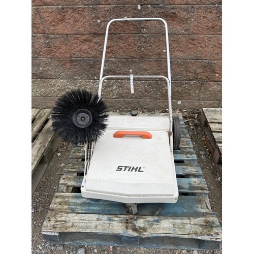 A Stihl KG550 pedestrian operated sweeper