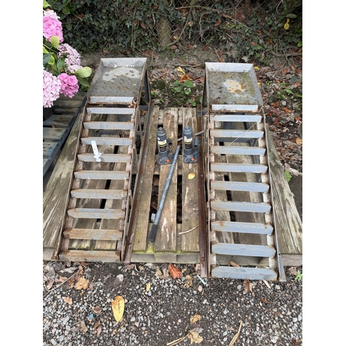 A pair of heavy duty vehicle inspection ramps together with two ...