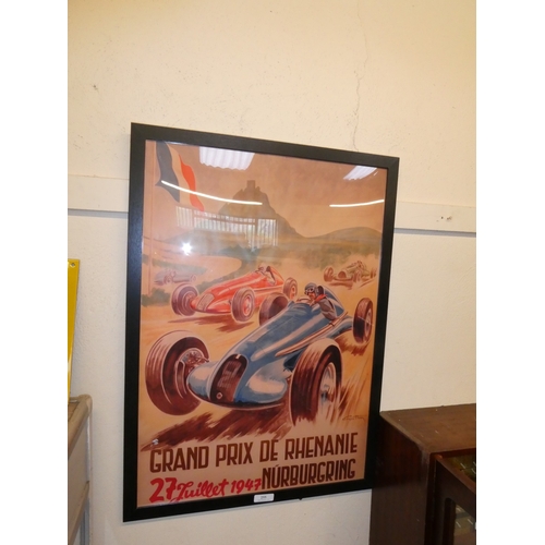A framed motor racing poster in the vintage style