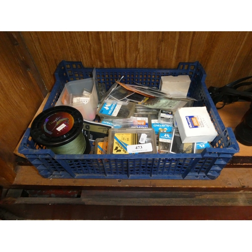 A large and varied assortment of fishing hooks together with a roll of ...