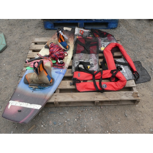 A wake board, tow ropes and various life jackets