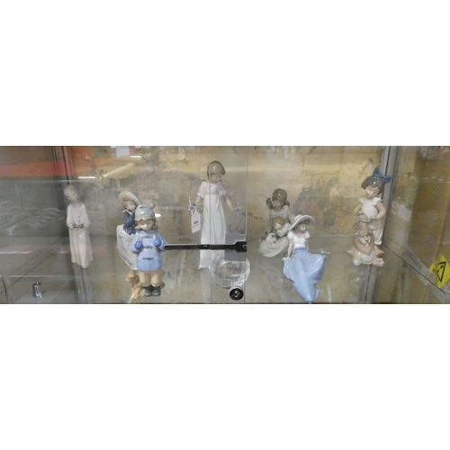 Five Nao figures together with two Lladro figures and a glass tea light ...