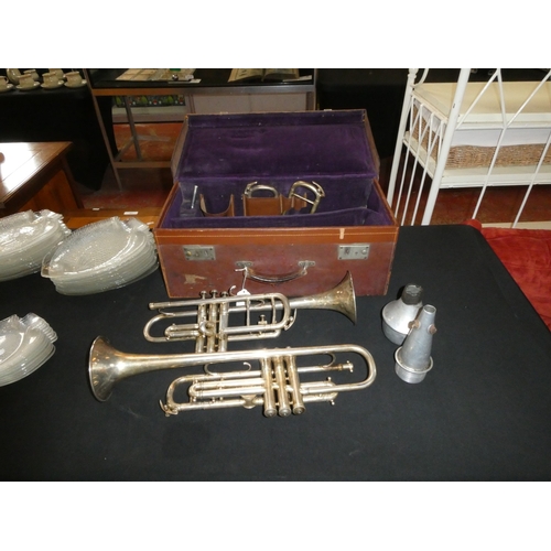 A pair of Hawkes & Son trumpets in fitted case
