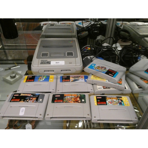 A mid century Super Nintendo entertainment centre together with an ...