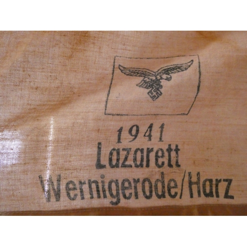 A World War II German Luftwaffe Red Cross flag with markings and dated 1941