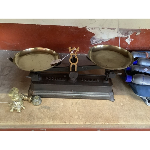A set of vintage 5kg balance scales together with two sets of scale weights