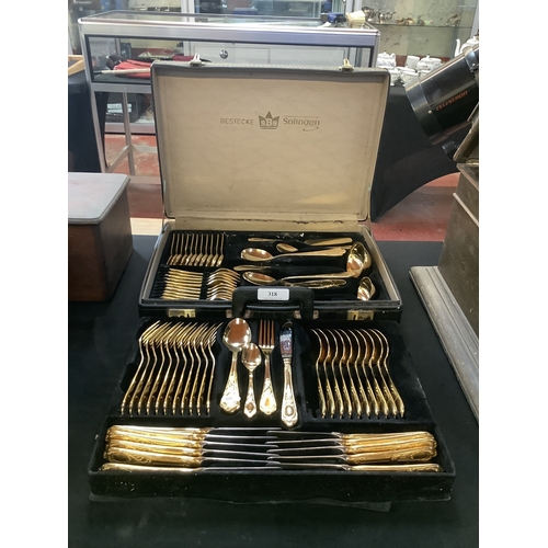 A canteen of gilded cutlery by Bestecke Solingen