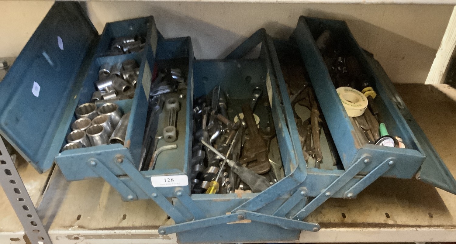 A cantilever tool box containing an assortment of tools