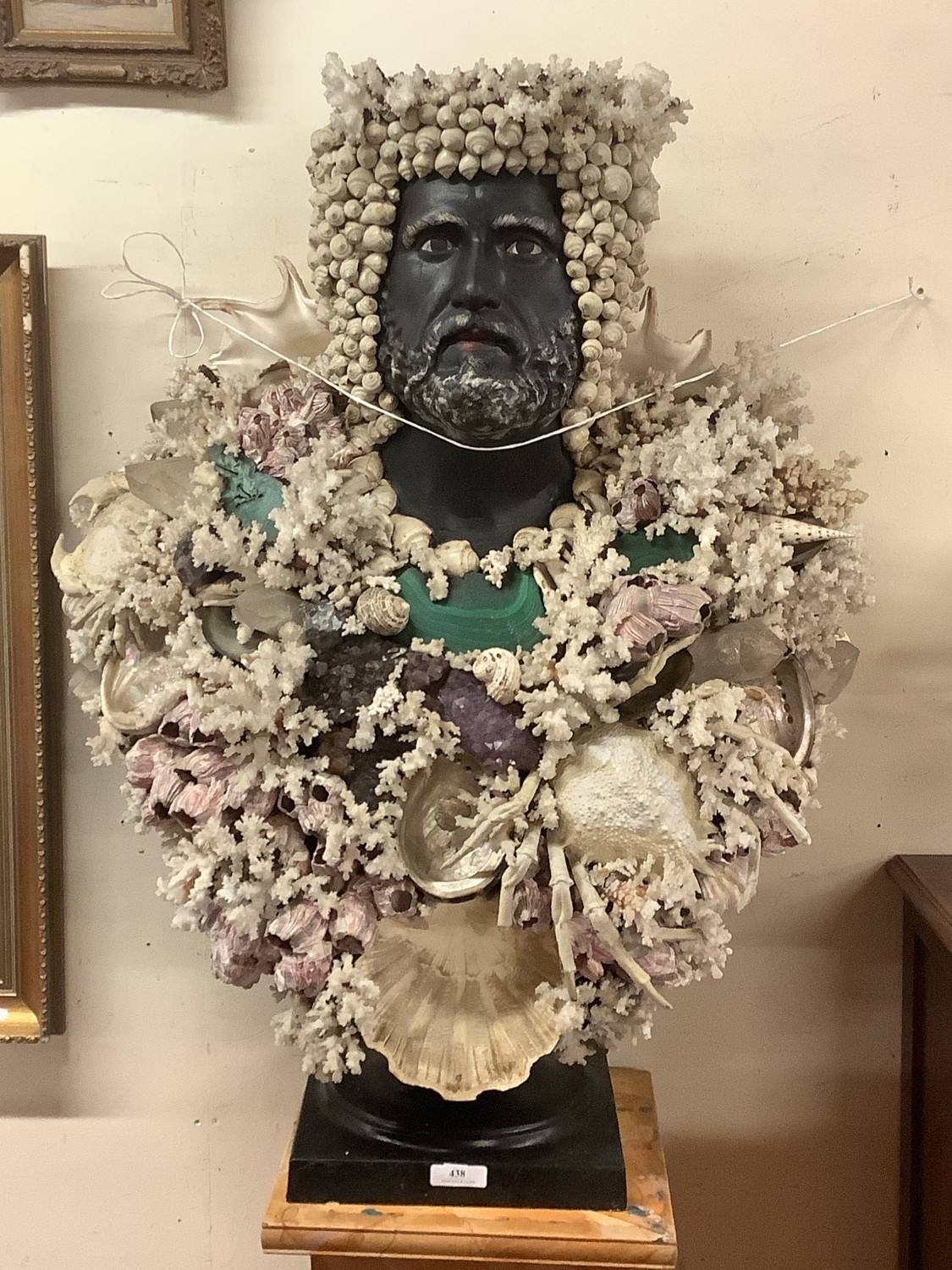A shell work and coral bust of King Neptune of large proportion mounted ...