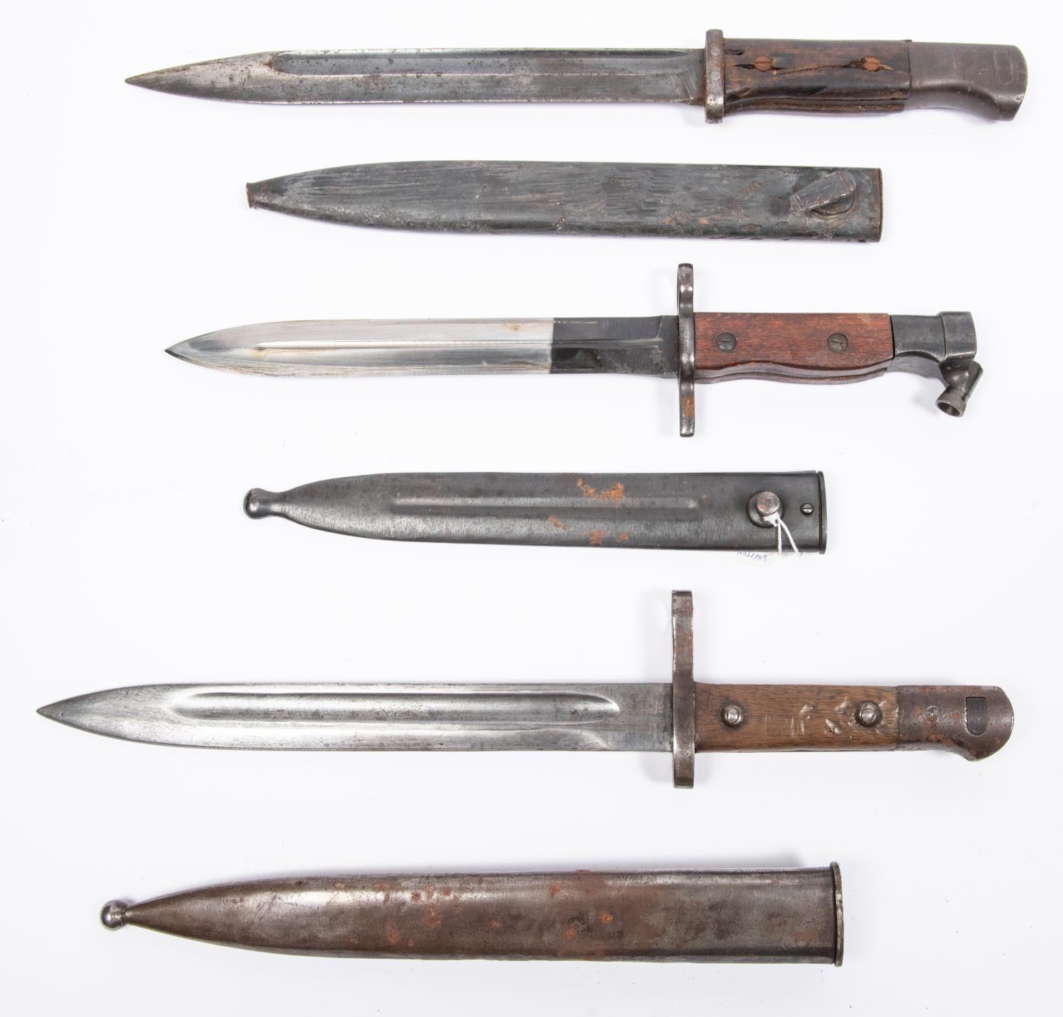 A Turkish M1935 bayonet; an Egyptian Hakim bayonet and a Mauser bayonet ...