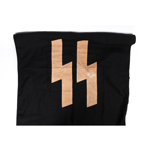 A Third Reich Waffen SS black flag, 56" x 35", with applied SS runes ...