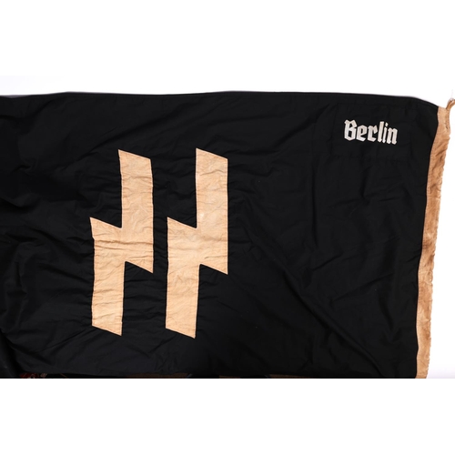 A Third Reich SS black flag, 56" x 35", applied SS runes, marked ...