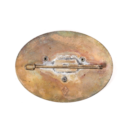 A Third Reich NSKK pin back enamelled badge, with blue centre and outer ...