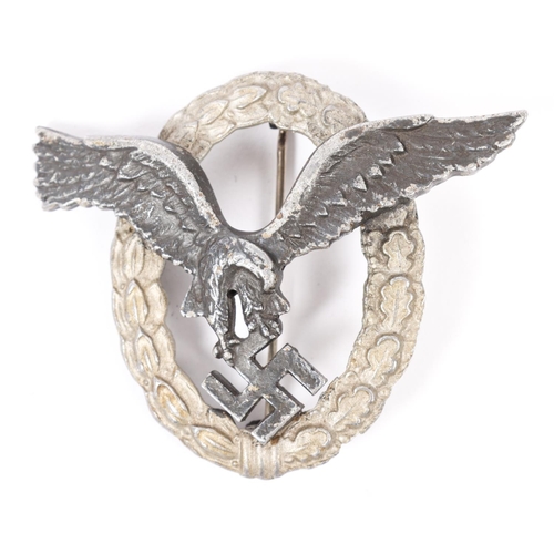A Third Reich Luftwaffe Pilot's badge, silver washed wreath , blued ...