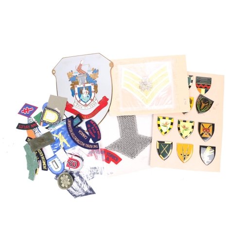 A box of mixed military insignia including Indian titles and formation ...