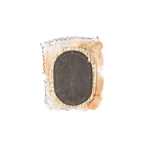 A Third Reich Cholm 1942 arm shield, attached to a piece of cloth ...
