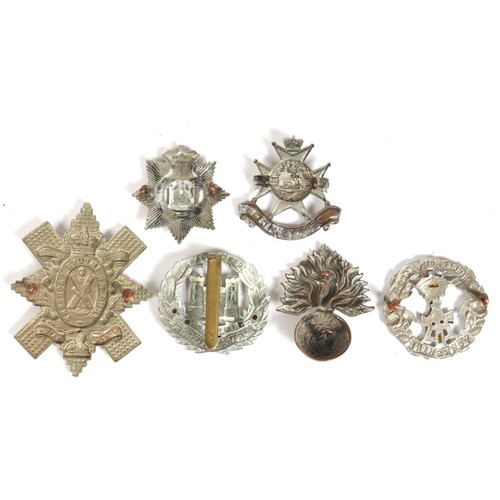 Four Victorian Infantry cap badges: Royal Fusiliers, Devonshire Regt ...