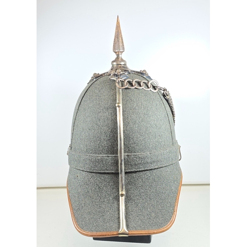 A post-1902 officer's grey cloth Home Service helmet of the 13th County of London (Kensington) Regim