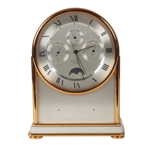 JEAN ROULET: A BRASS DESK CLOCK the silvered dial with Roman numerals ...