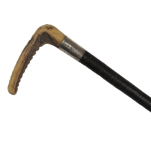 A GENTLEMAN'S HUNTING CROP with antler handle, silver collar and ...