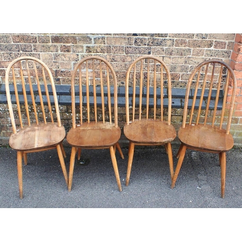 A SET OF FOUR ERCOL STYLE STICK-BACK CHAIRS the hoop backs 97cm high ...