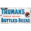 A PAINTED ENAMEL ADVERTISING SIGN FOR 'TRUMAN'S EAGLE BRAND BOTTLED ...
